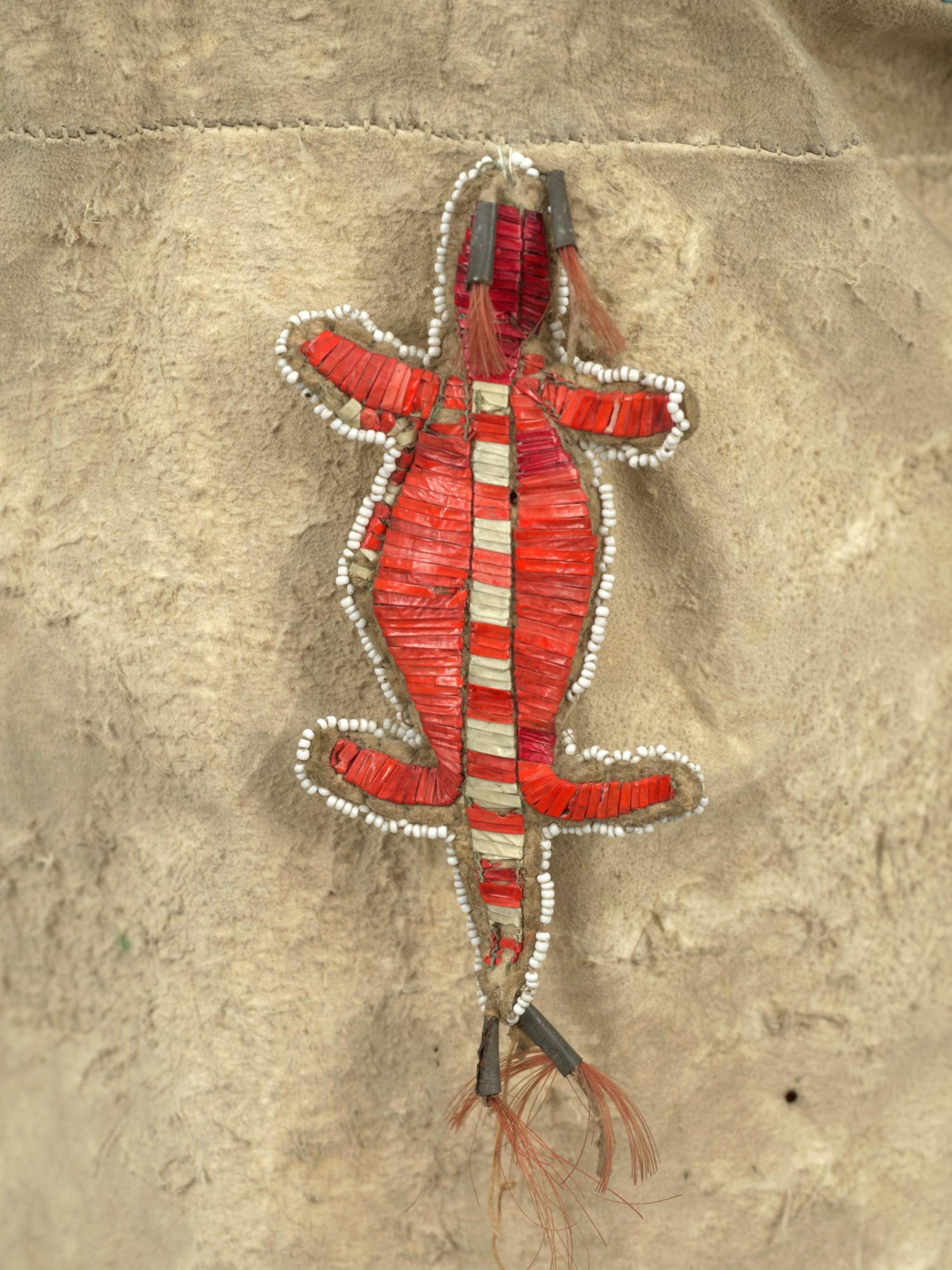 Lakota Sioux beaded girl's dress with umbilical cord lizard-shaped bag ...