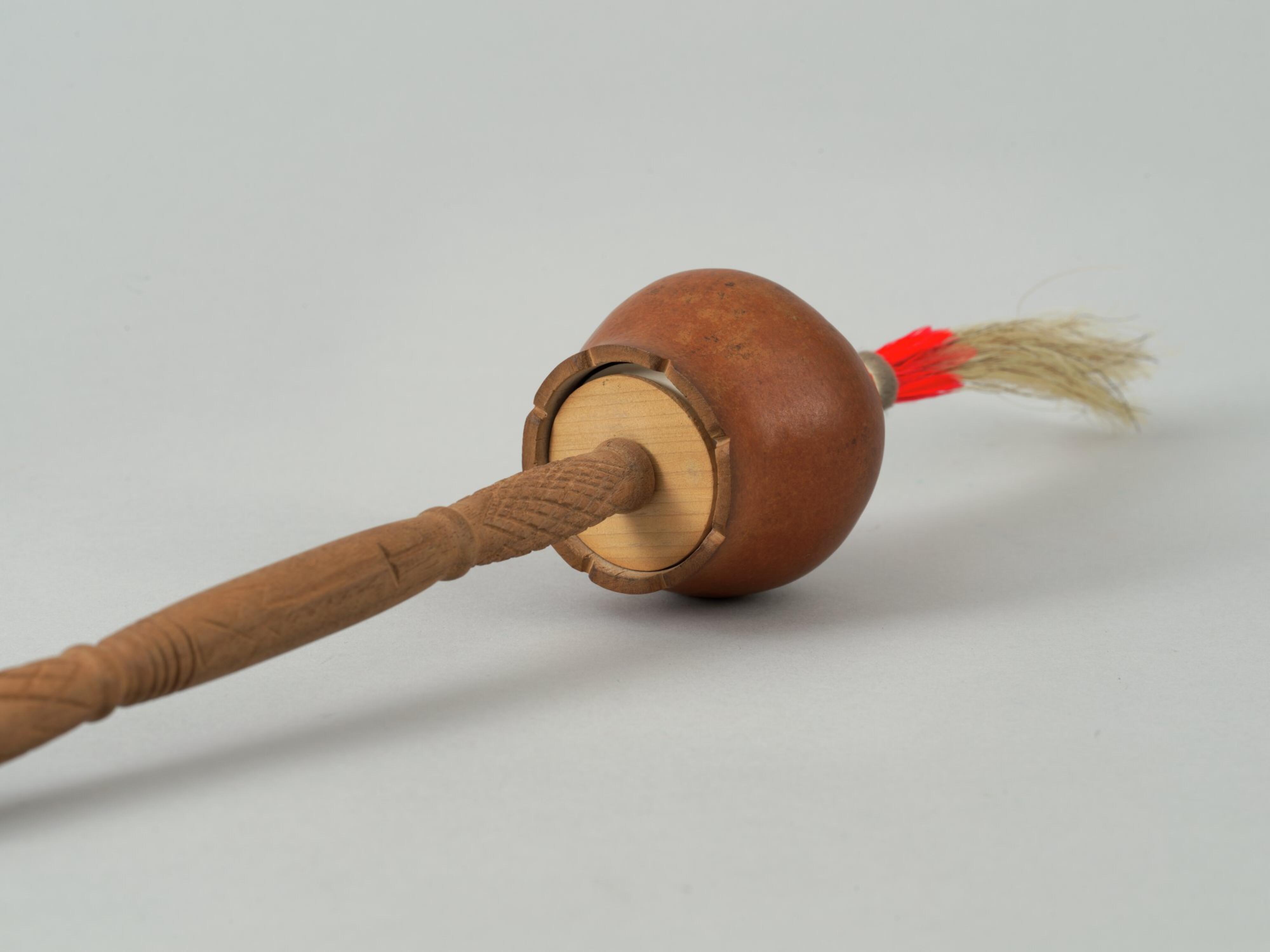 Gourd peyote rattle with trimmed lower edge decorated in eight v ...