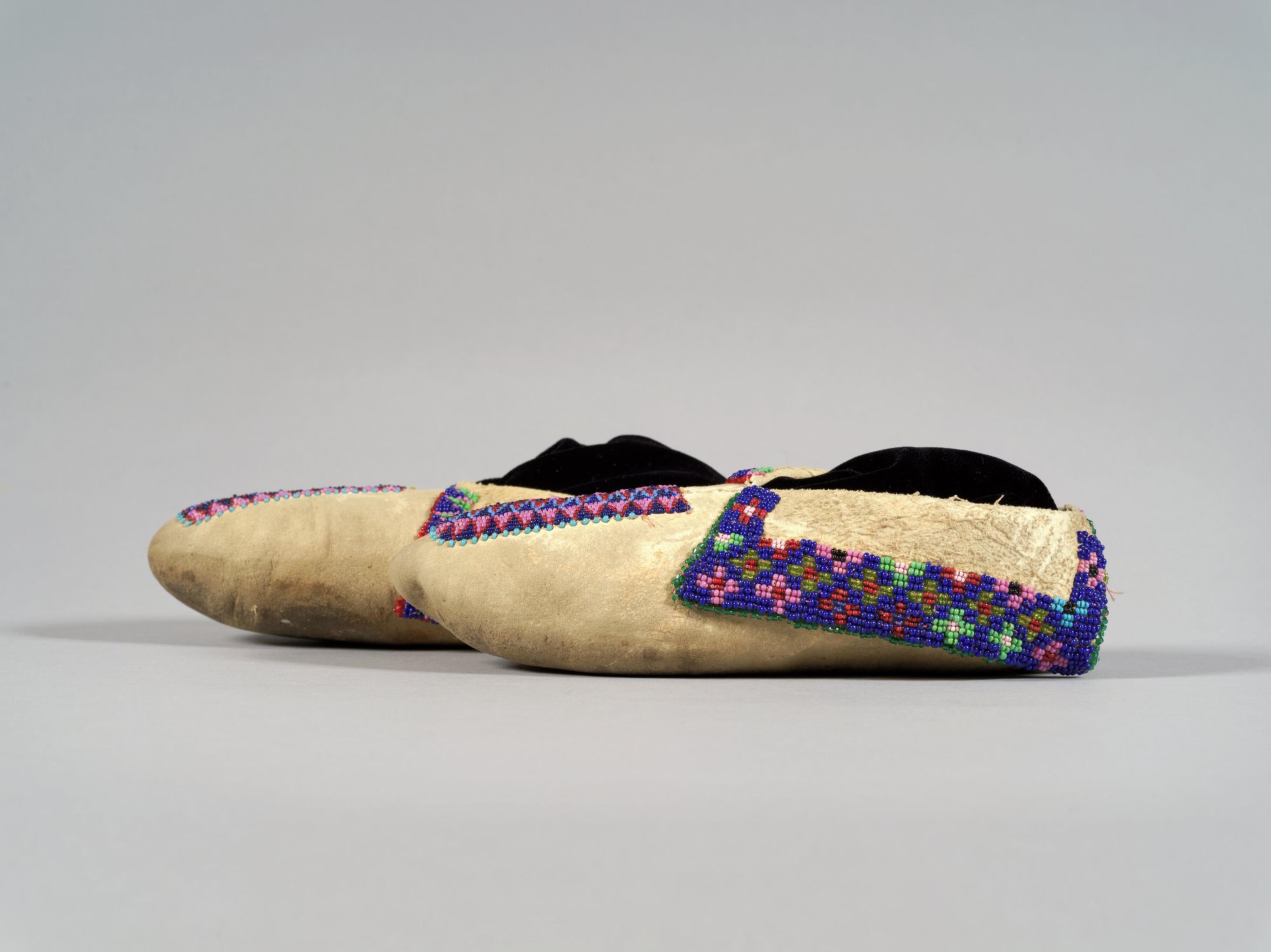 Soft soled leather moccasins with beadwork on vamp and on cuff ...
