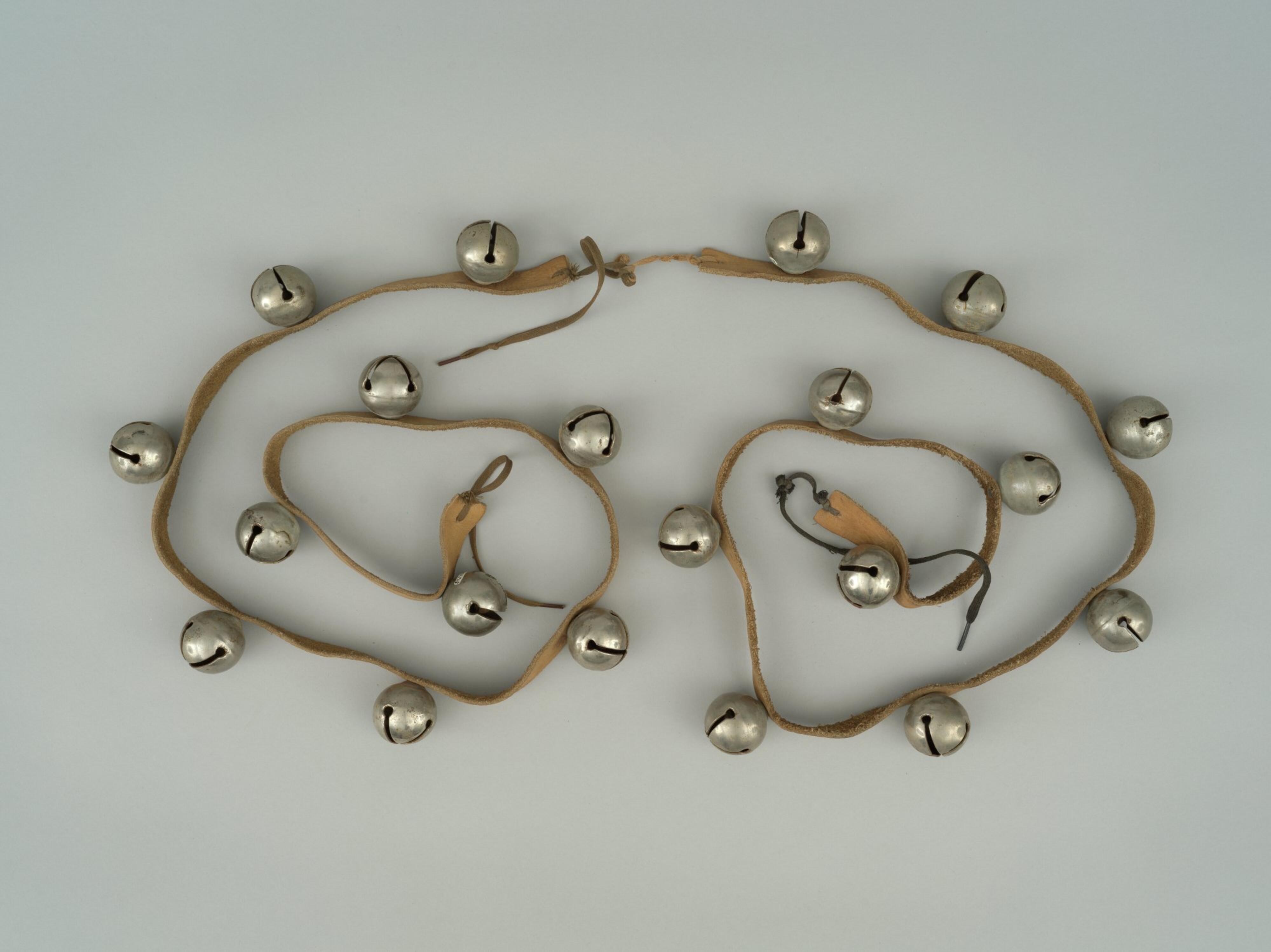 Metal dance bells on leather strips / Unknown - Gilcrease Museum
