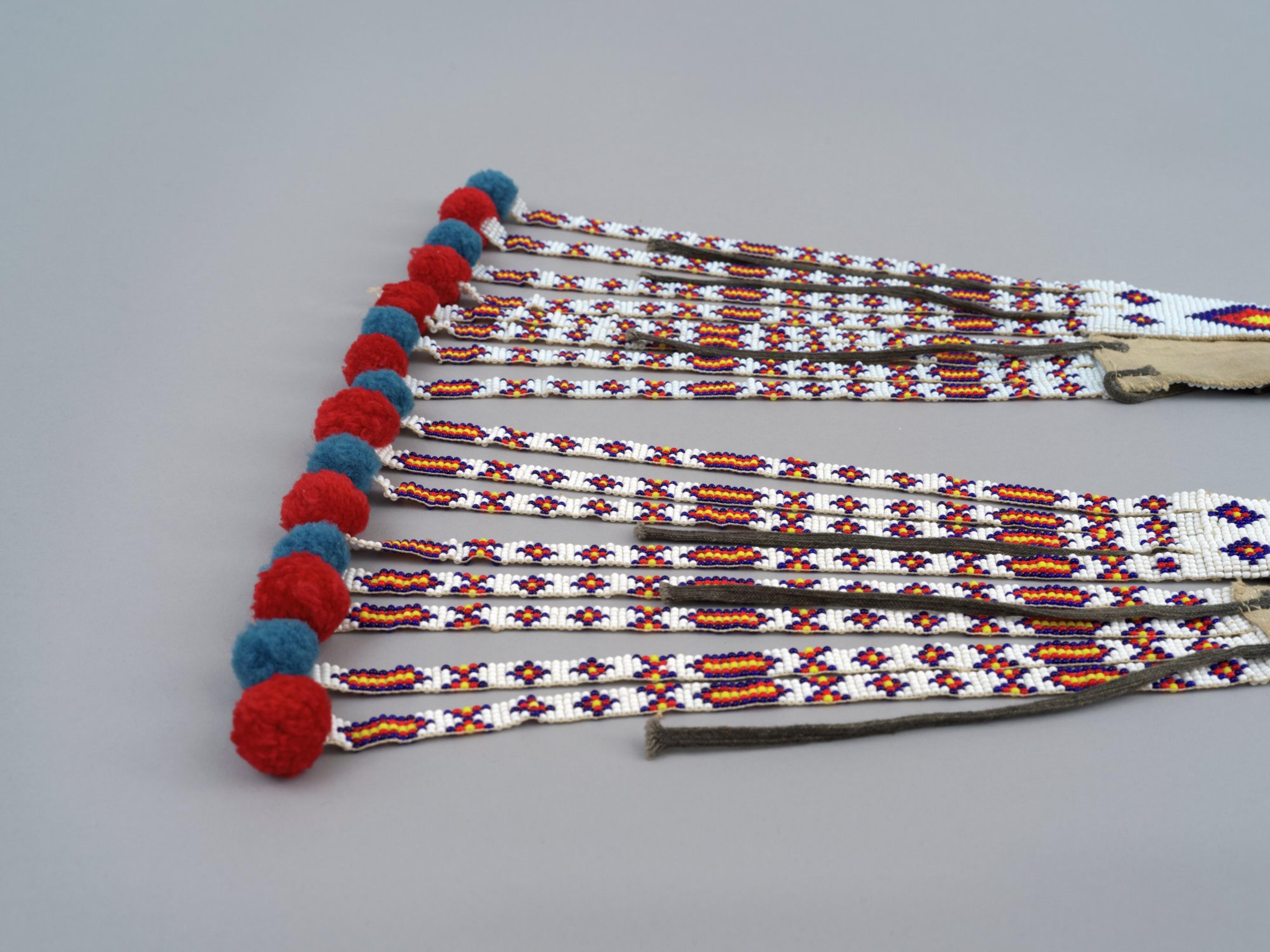 Beaded arm bands with geometric design in black, red, yellow, blue and ...